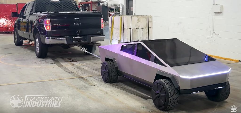 Tesla Cybertruck Mini takes out full sized Ford F 150 in tug of war bout