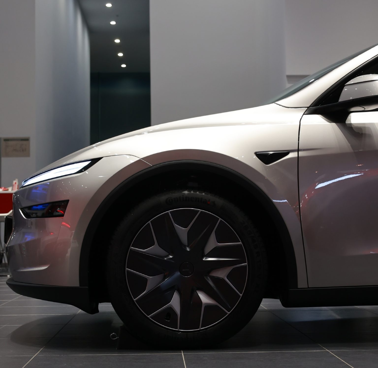 Tesla Optimus units line up in Fremont's pilot production line